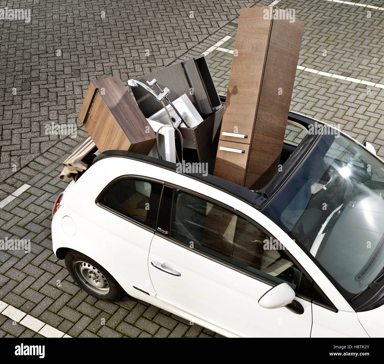 Moving Into New Home using a small car Stock Photo - Alamy