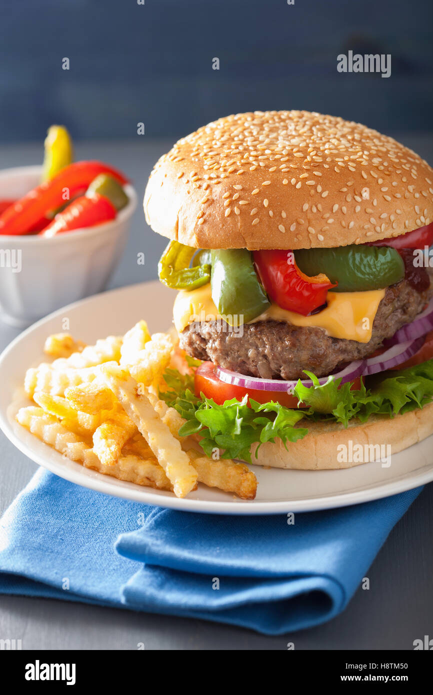 homemade cheese burger with peppers tomato onion Stock Photo - Alamy