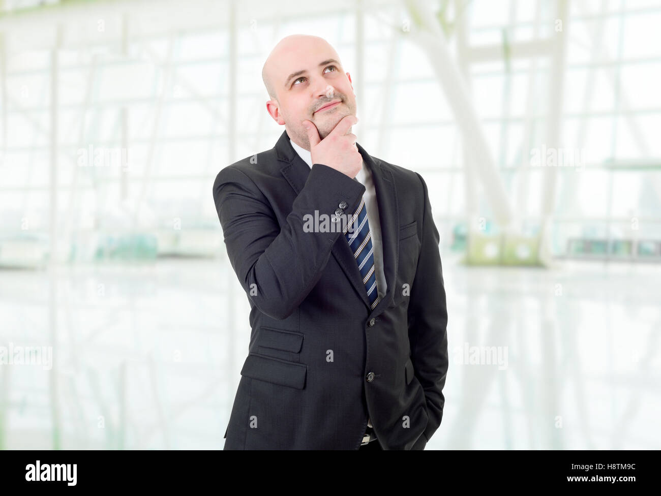 young business man thinking, at the office Stock Photo - Alamy