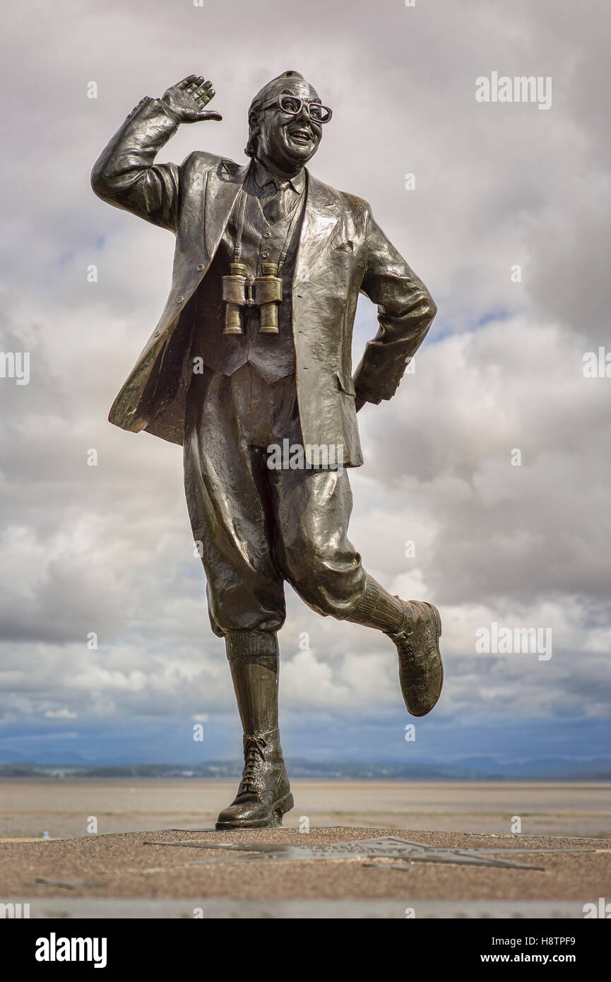 Statue of comedian Eric Morecambe in classic pose on the sea-front at ...