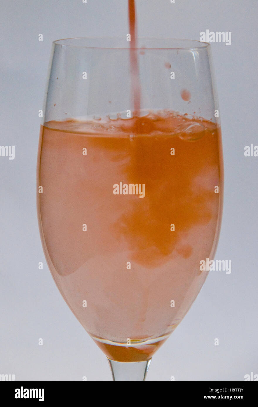 glas with amber liquid Stock Photo - Alamy