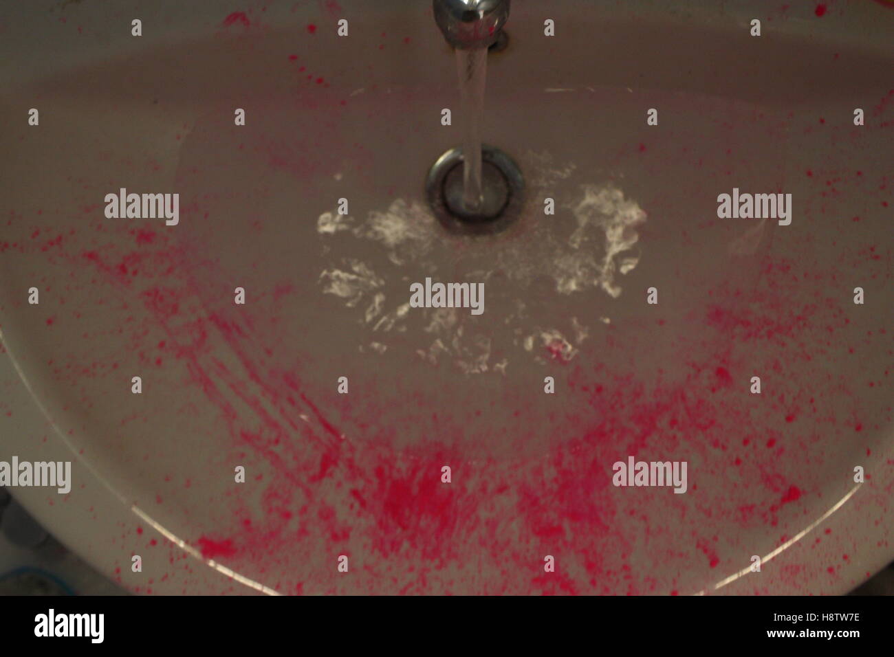 Pink eye make up smashed in a sink with running water Stock Photo - Alamy