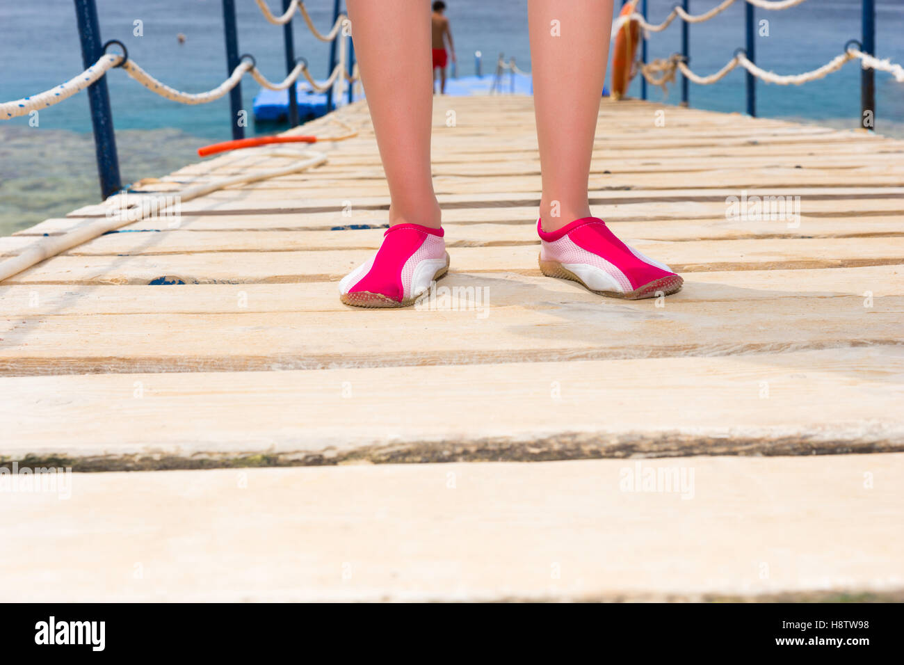 Feet in pink flip flops hi-res stock photography and images - Alamy