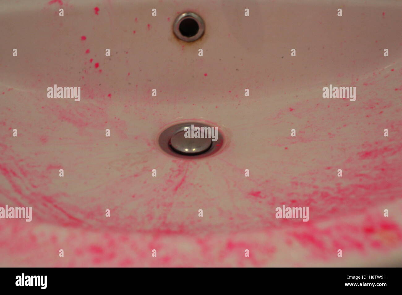 Pink eye make up smashed in a sink Stock Photo - Alamy