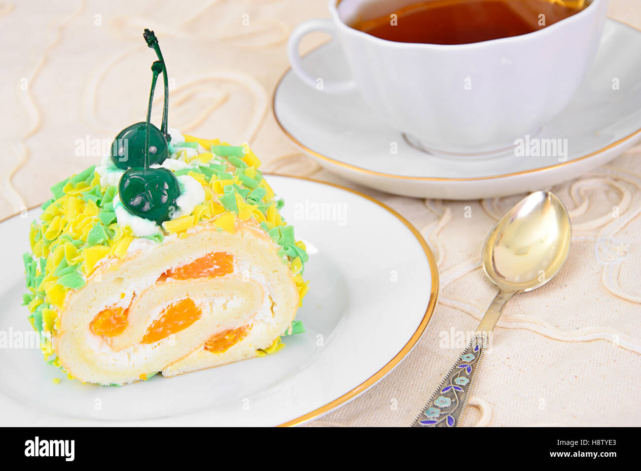 Sponge Roulade with Cream, Mandarin and Cherry Stock Photo - Alamy