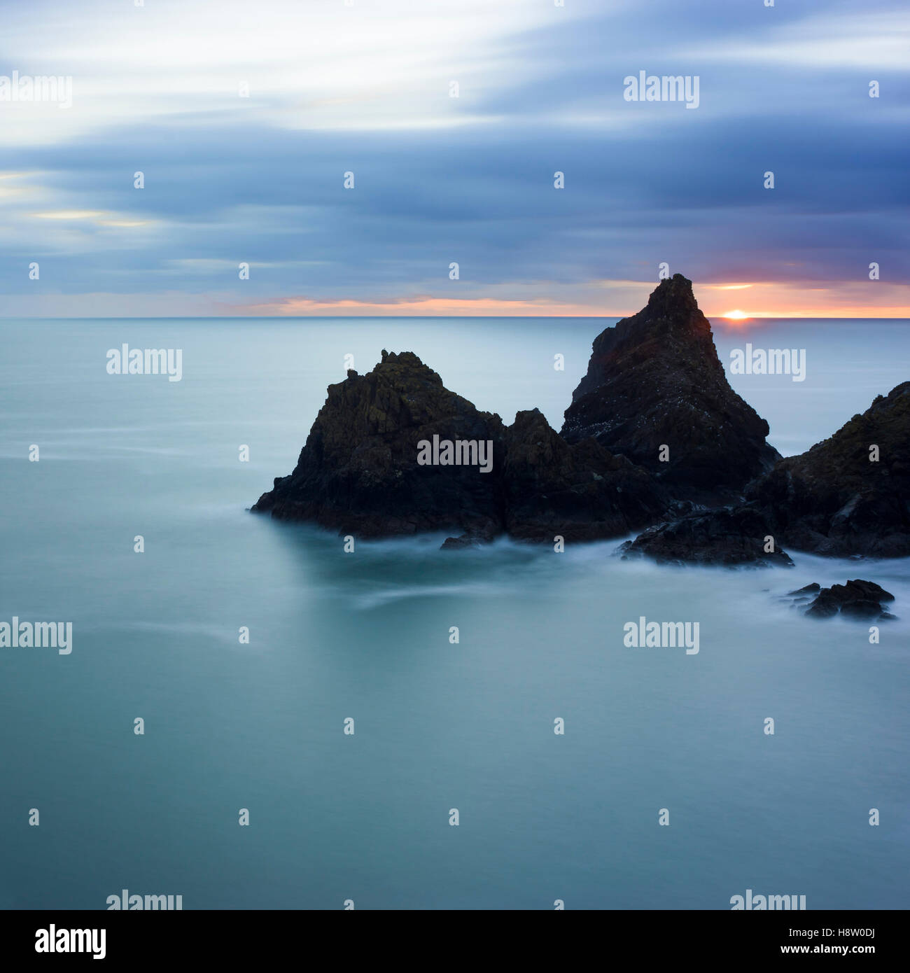Gull Rock at Kynance Cove, Cornwall, England at sunset Stock Photo - Alamy