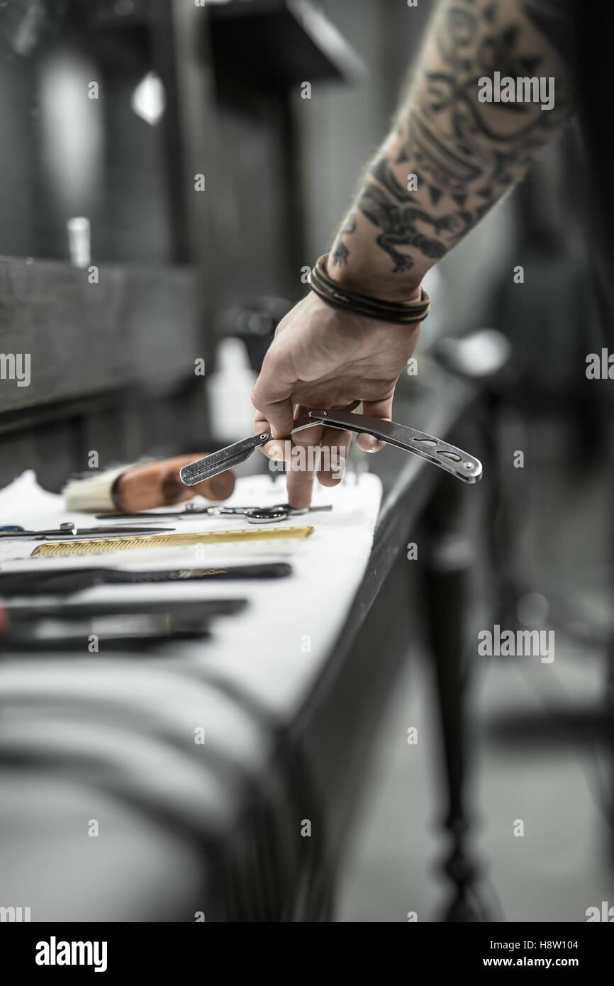 Hand with straight blade Stock Photo - Alamy