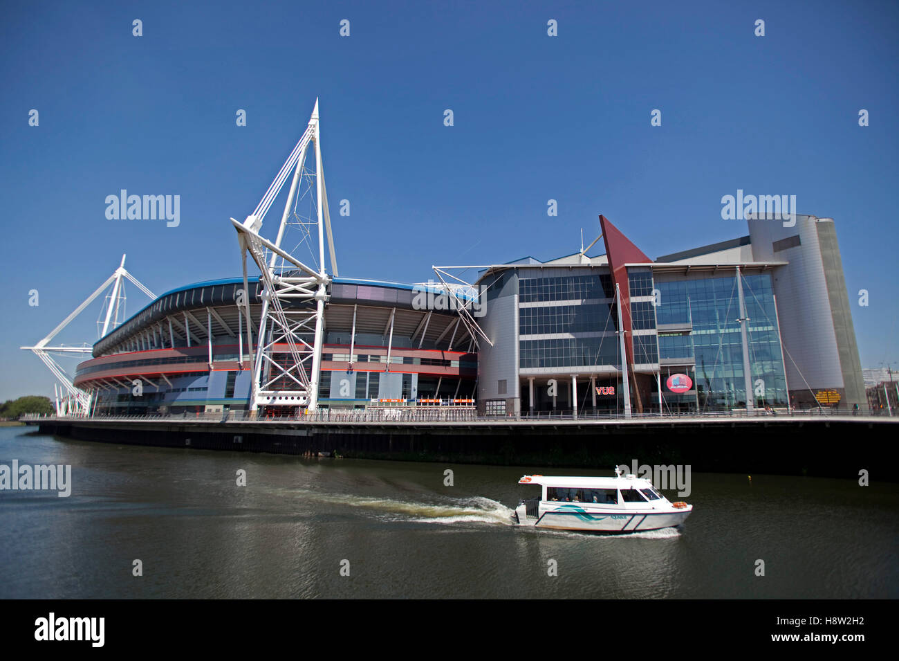 Millennium Stadium sports centre with boat on river, Cardiff, Wales ...
