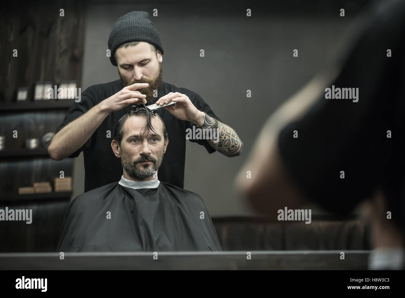 Preparing for haircut in barbershop Stock Photo - Alamy