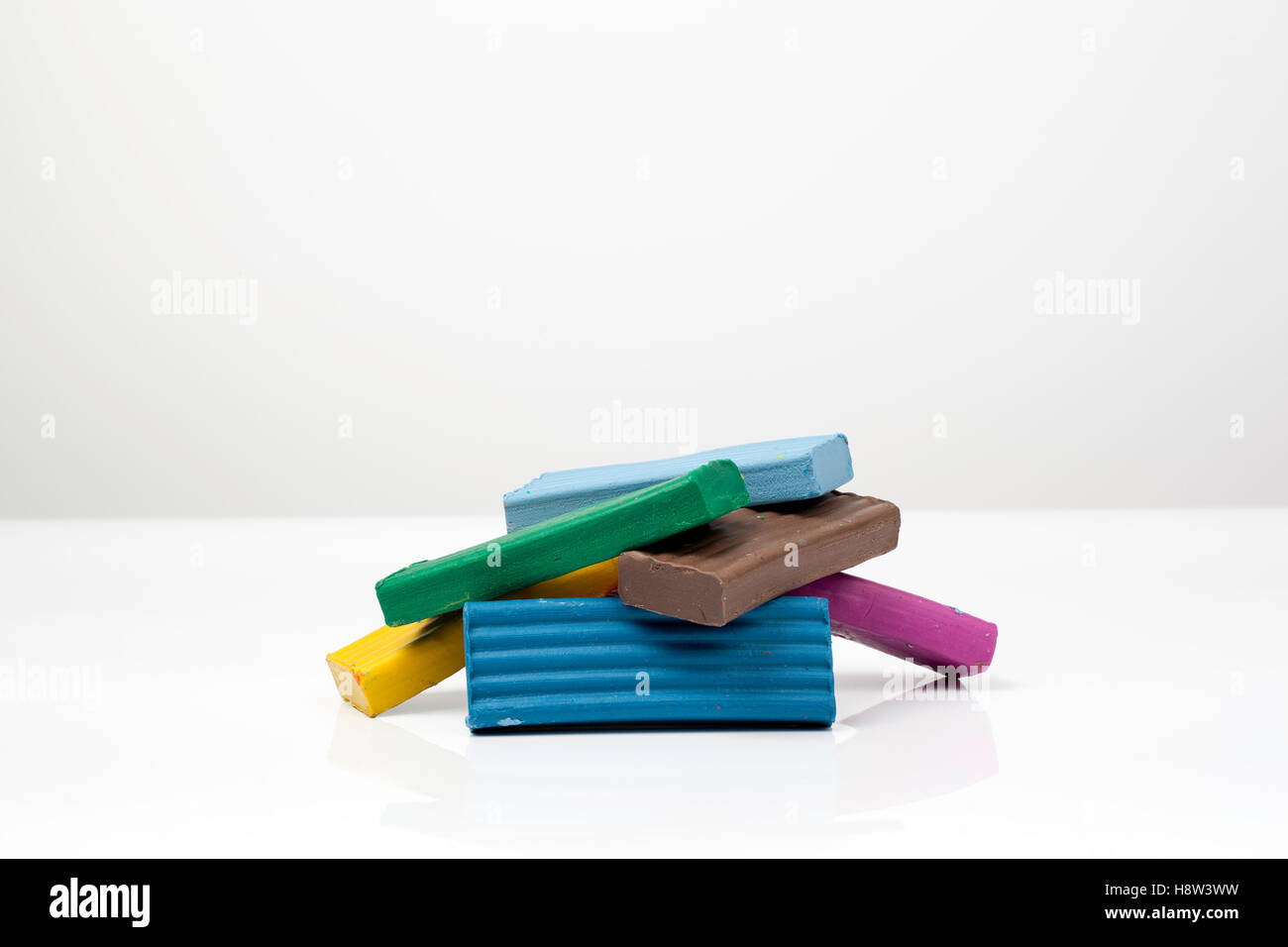 colorful plasticine blocks on white Stock Photo - Alamy