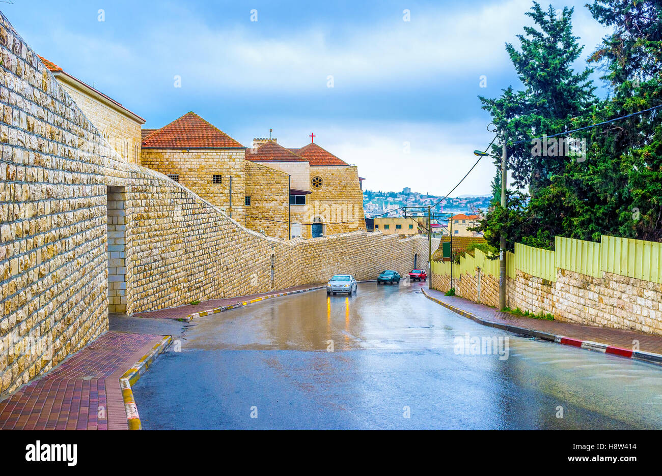 Rainy El-Wadi El-Jawani road with Carmelite monastery of Nazaret ...