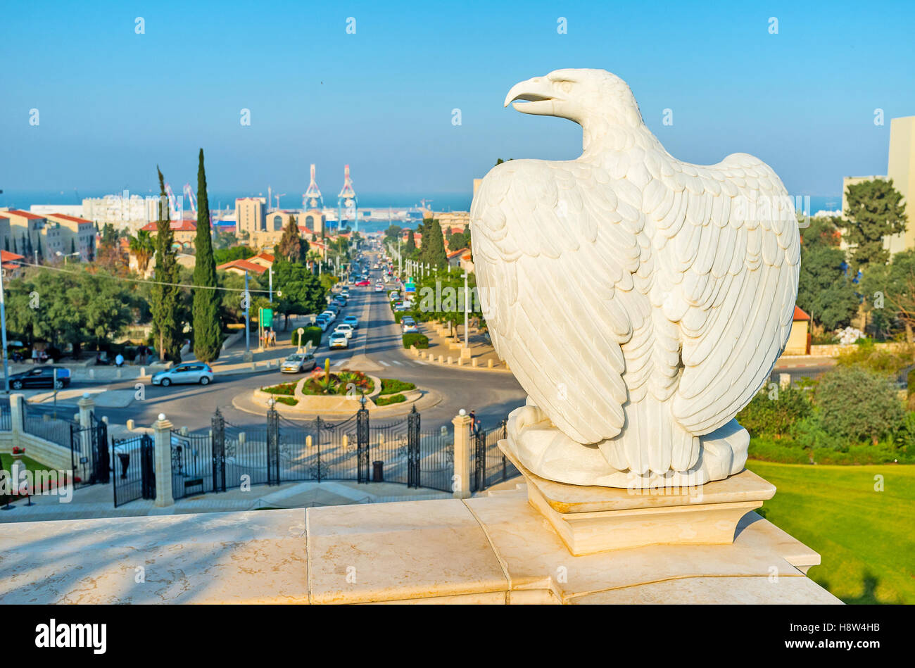 The sculpture of white stone eagle in Bahai Garden and the Ben Gurion ...