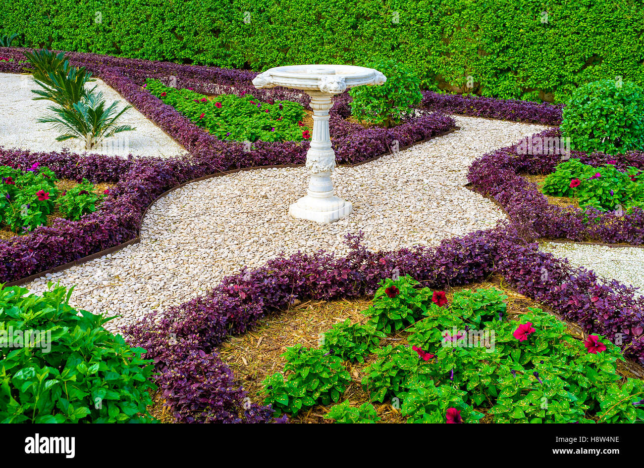 The footpaths in Bahai gardens fenced with different plant borders and ...