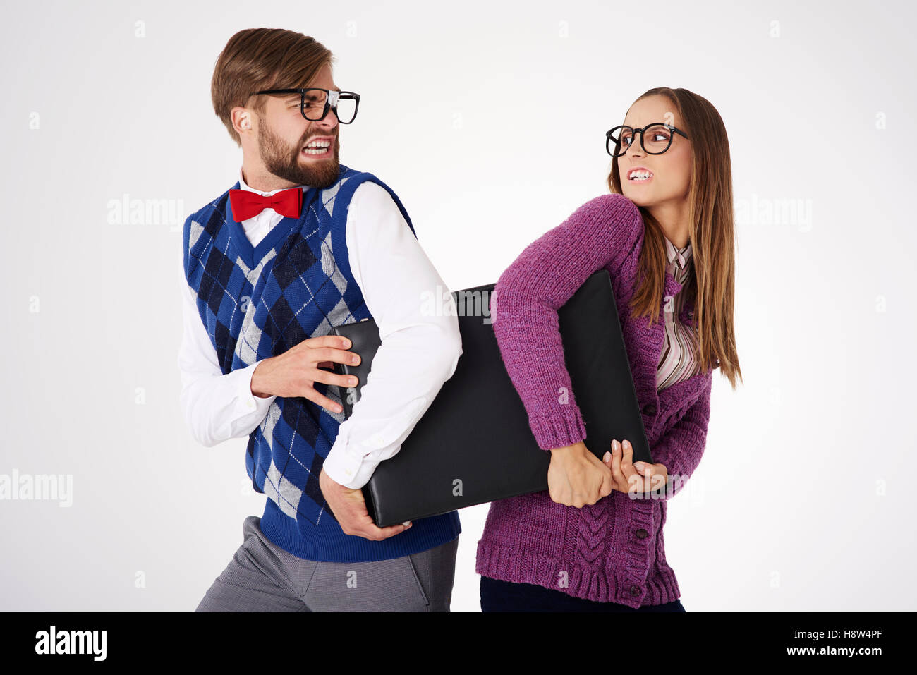 Angry geek couple fighting together Stock Photo - Alamy