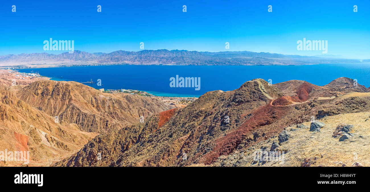 The scenic colorful landscape of Eilat mountains with Aqaba Gulf in the ...
