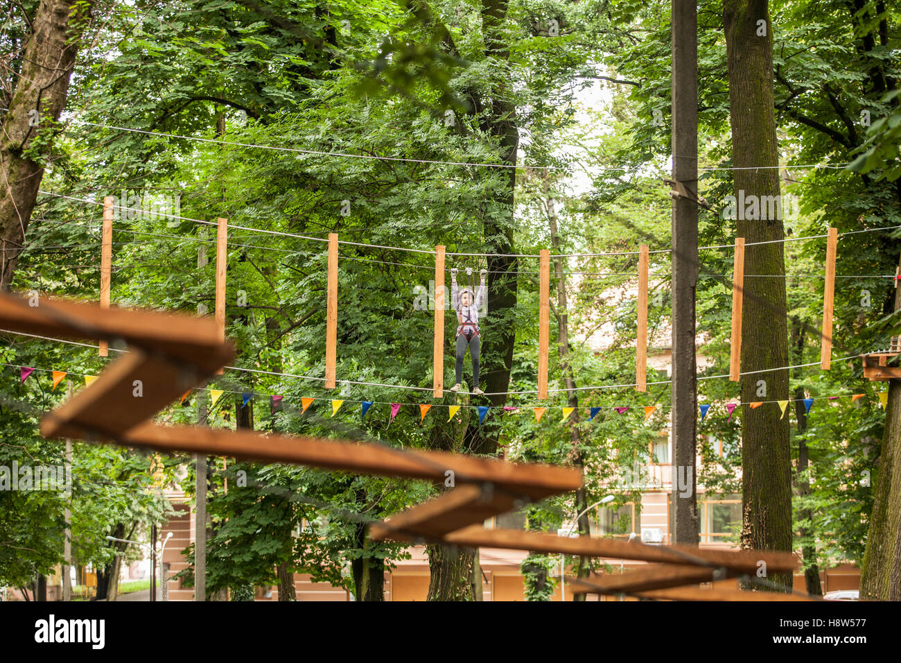 Child in a adventure playground Stock Photo - Alamy