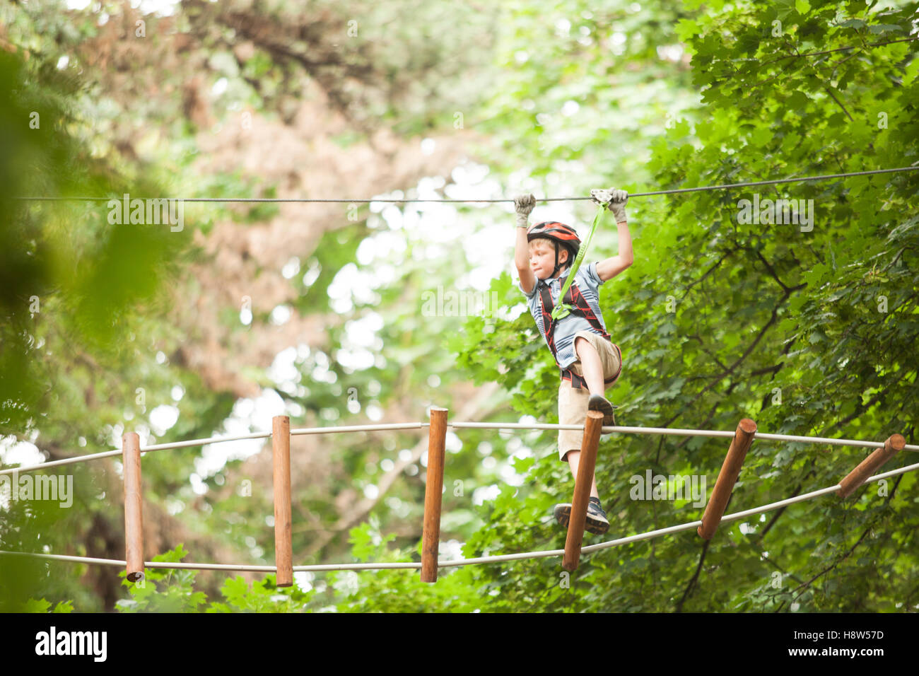Child in a adventure playground Stock Photo - Alamy
