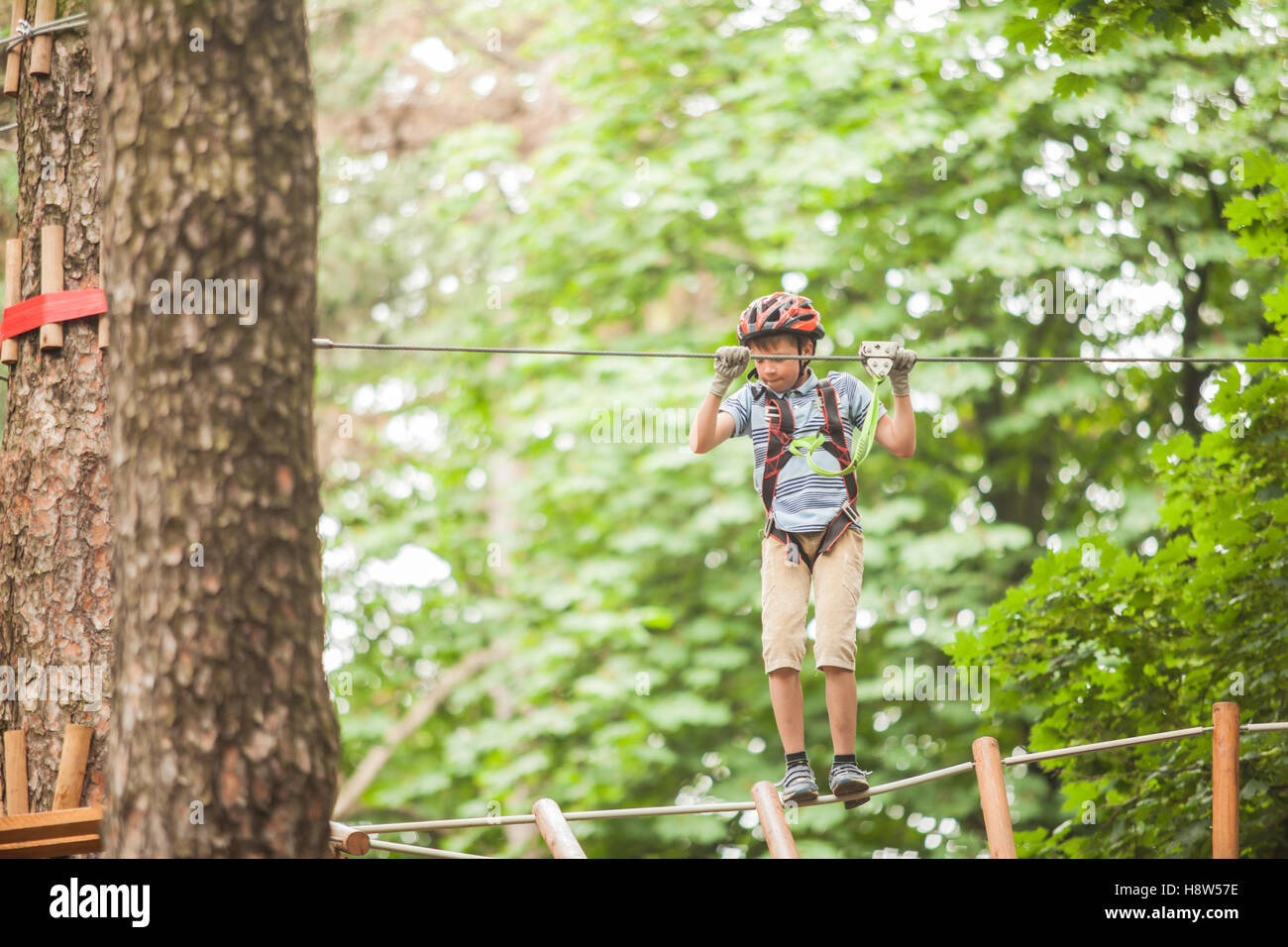 Child in a adventure playground Stock Photo - Alamy