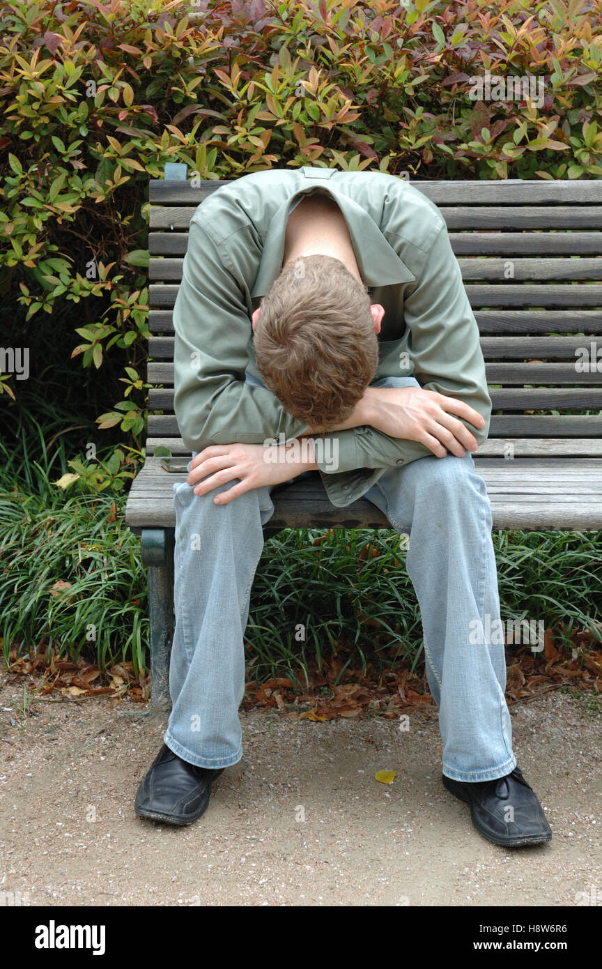Young man resting his head Stock Photo - Alamy