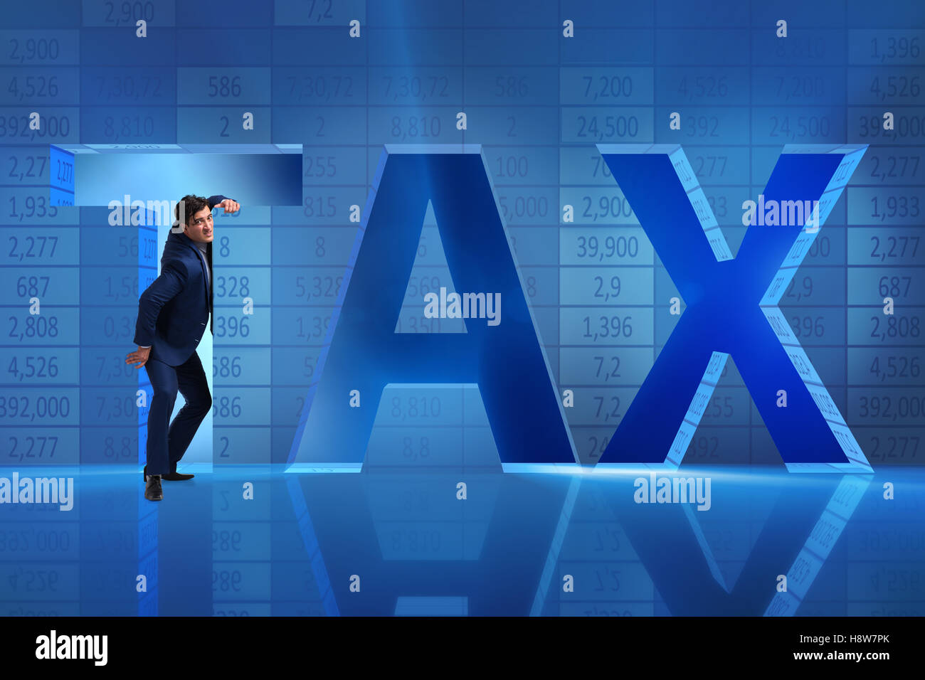 Businessman in high taxes concept Stock Photo - Alamy