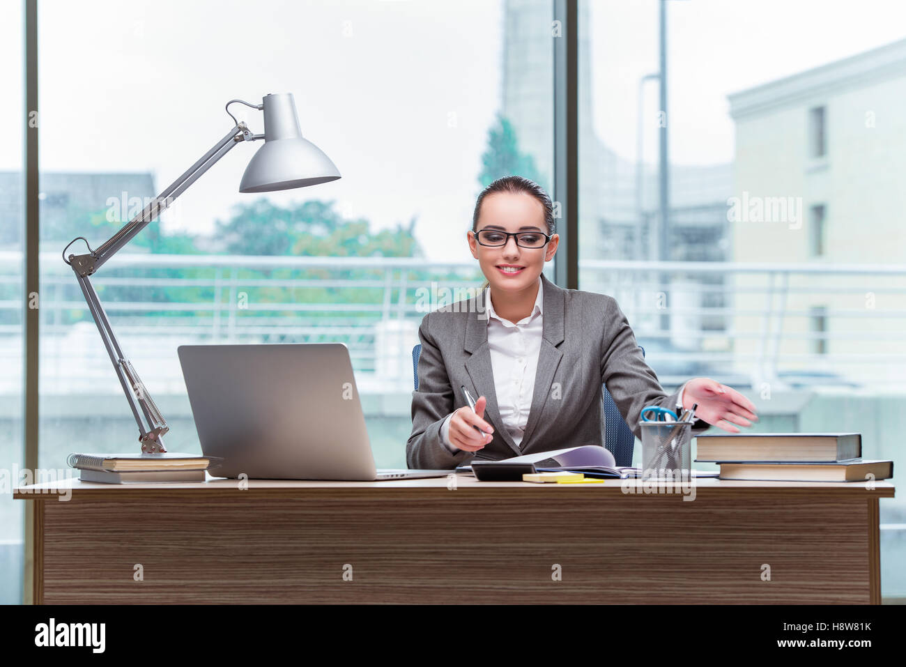 Young assistant working in the office Stock Photo - Alamy