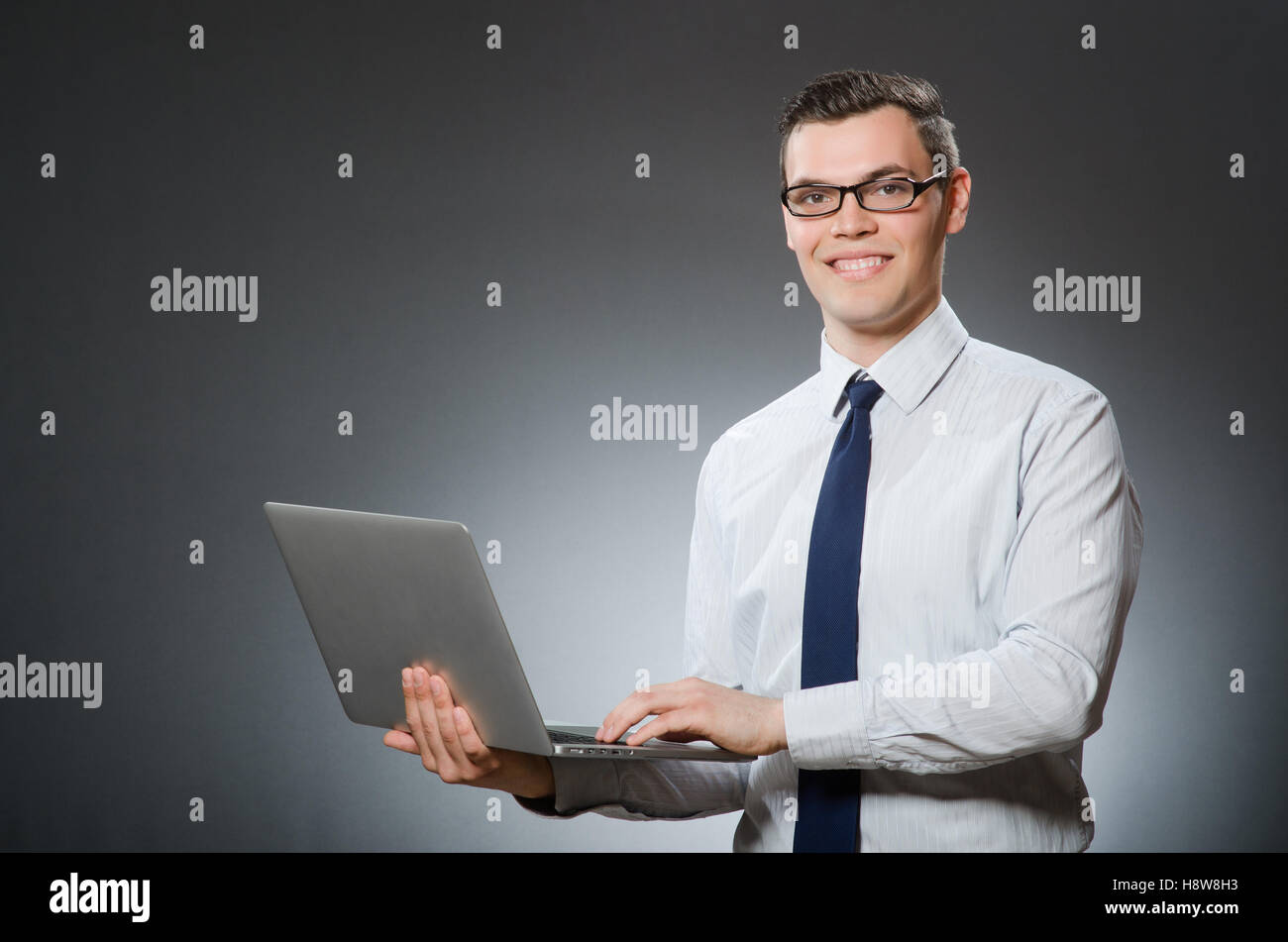 Man with laptop in business concept Stock Photo - Alamy