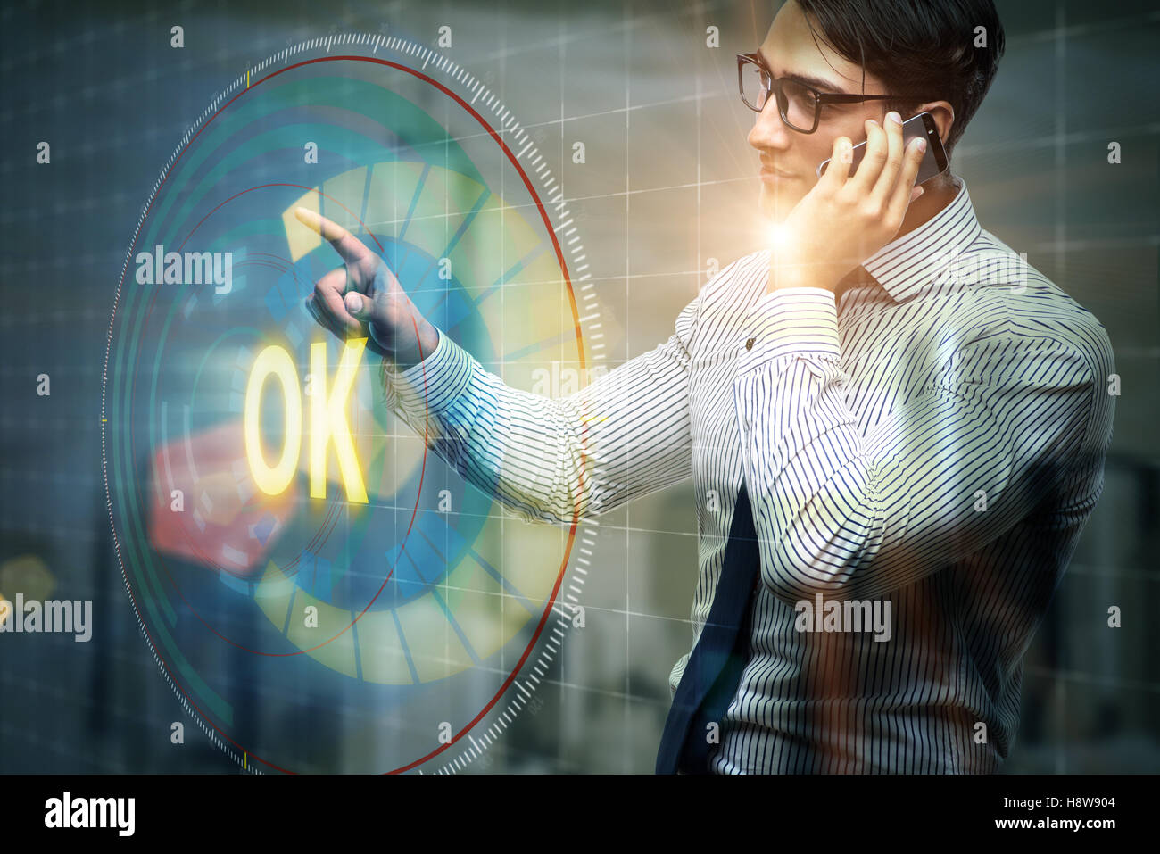 Businessman pressing virtual button OK Stock Photo - Alamy
