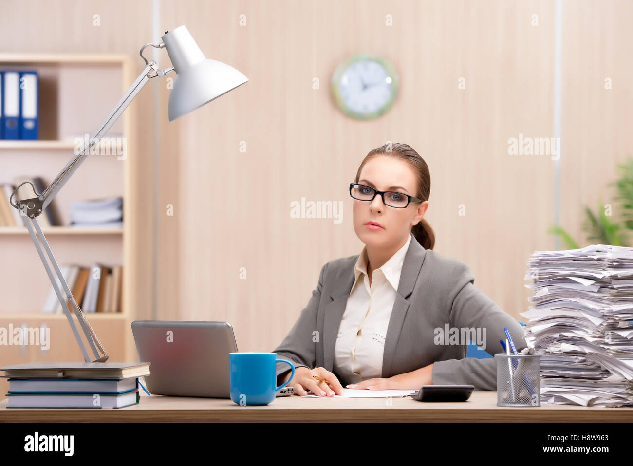 Businesswoman under stress from too much work in the office Stock Photo ...