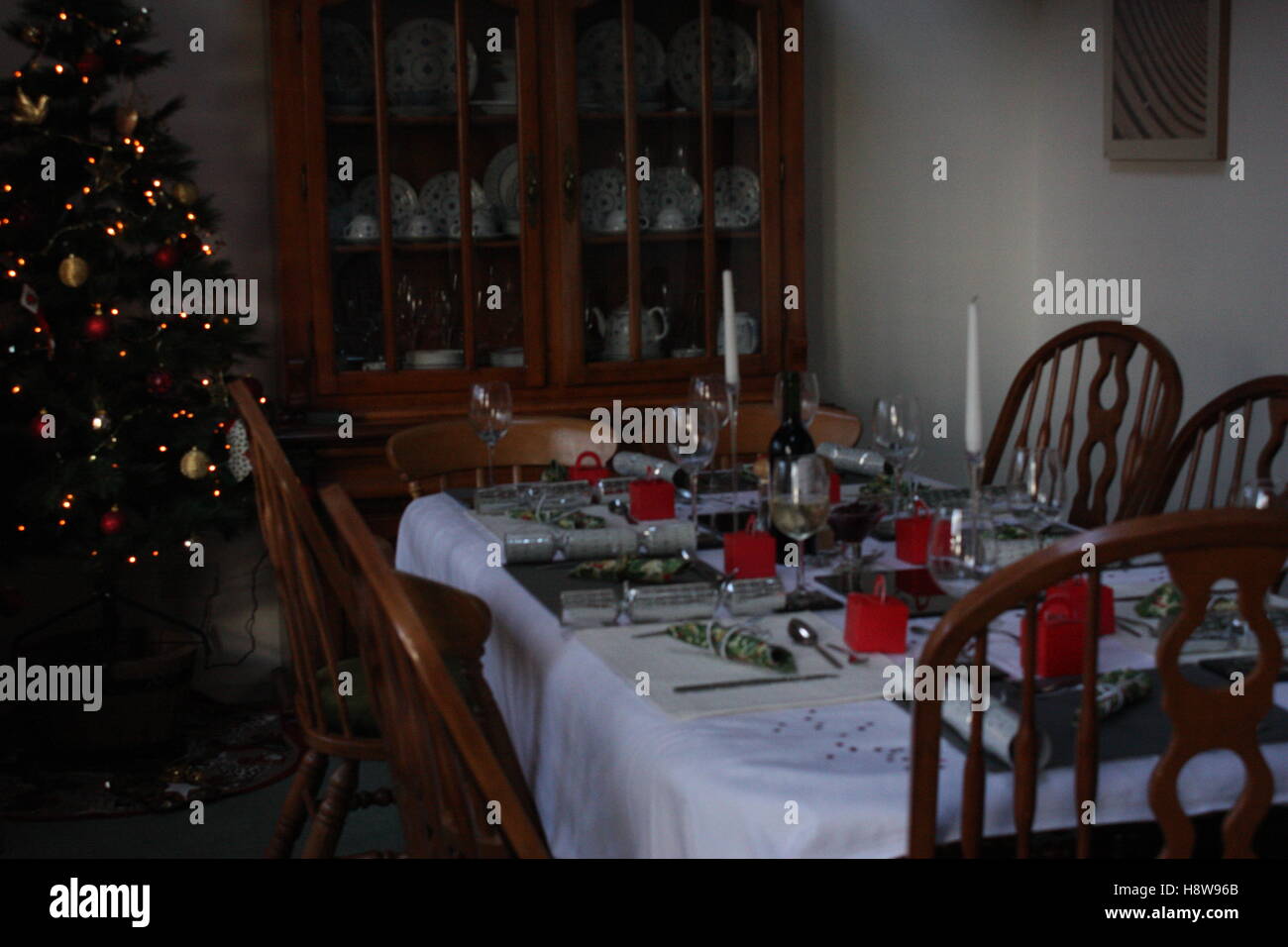 Table set up with crackers and candlesticks ready for Christmas lunch ...