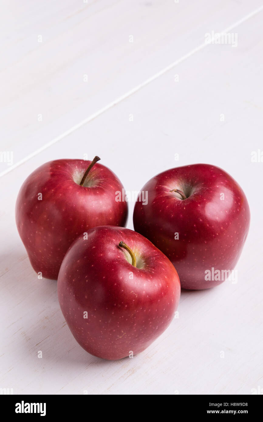 fresh shiny red apple on white table Stock Photo - Alamy