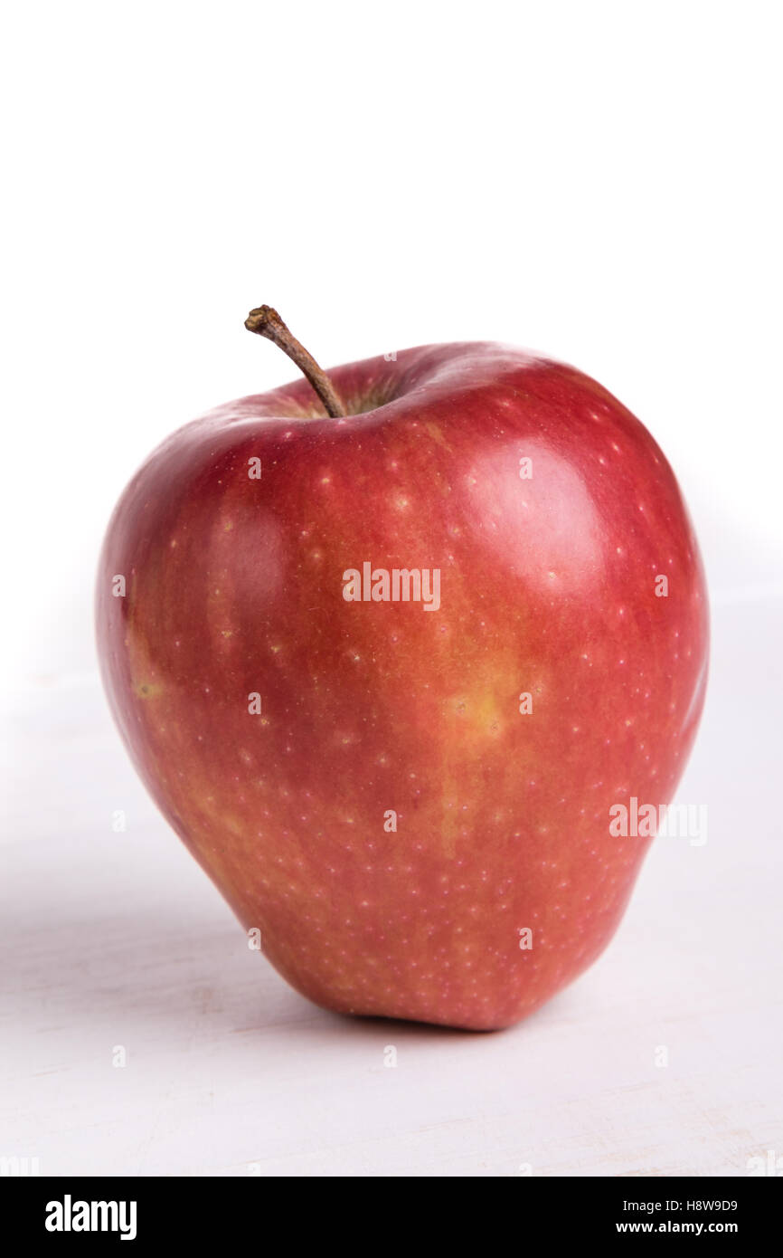 fresh shiny red apple on white table Stock Photo - Alamy