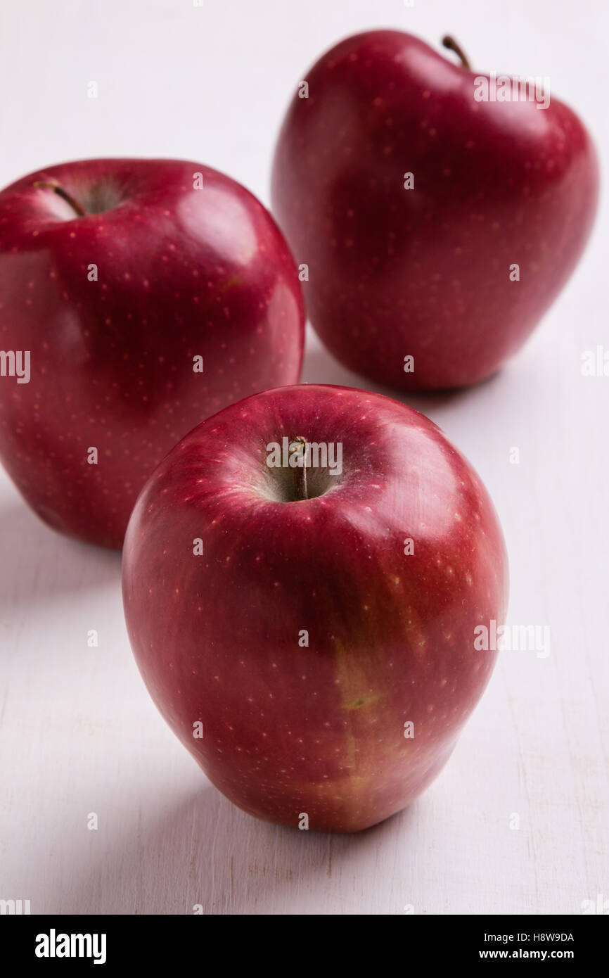 fresh shiny red apple on white table Stock Photo - Alamy