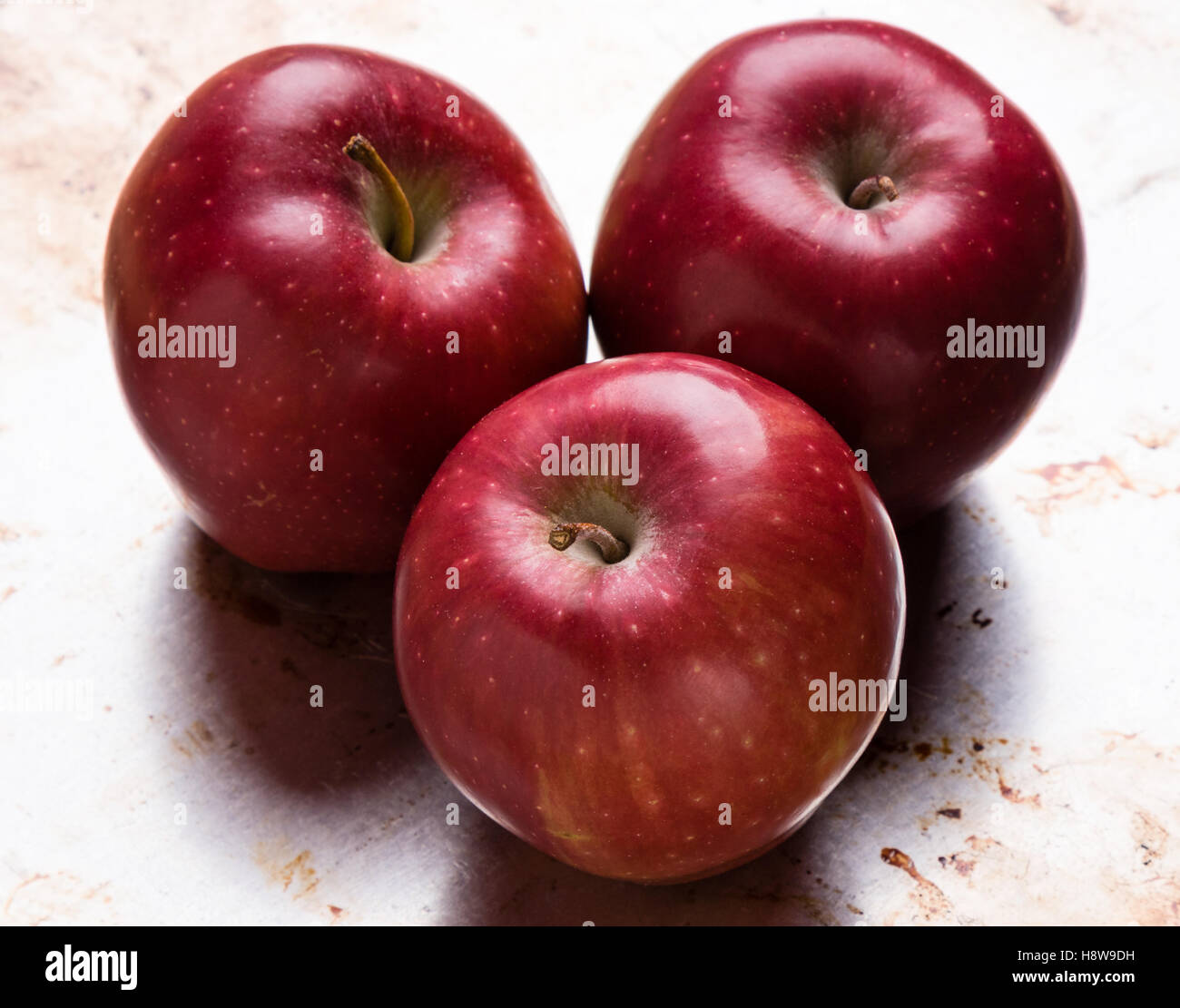 fresh shiny red apple on steel plate Stock Photo - Alamy