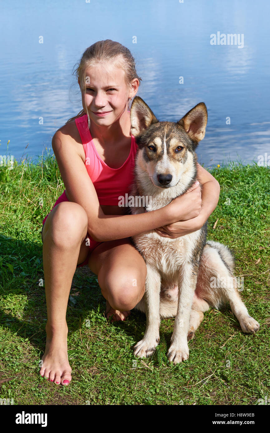 Happy girl with her dog Stock Photo - Alamy
