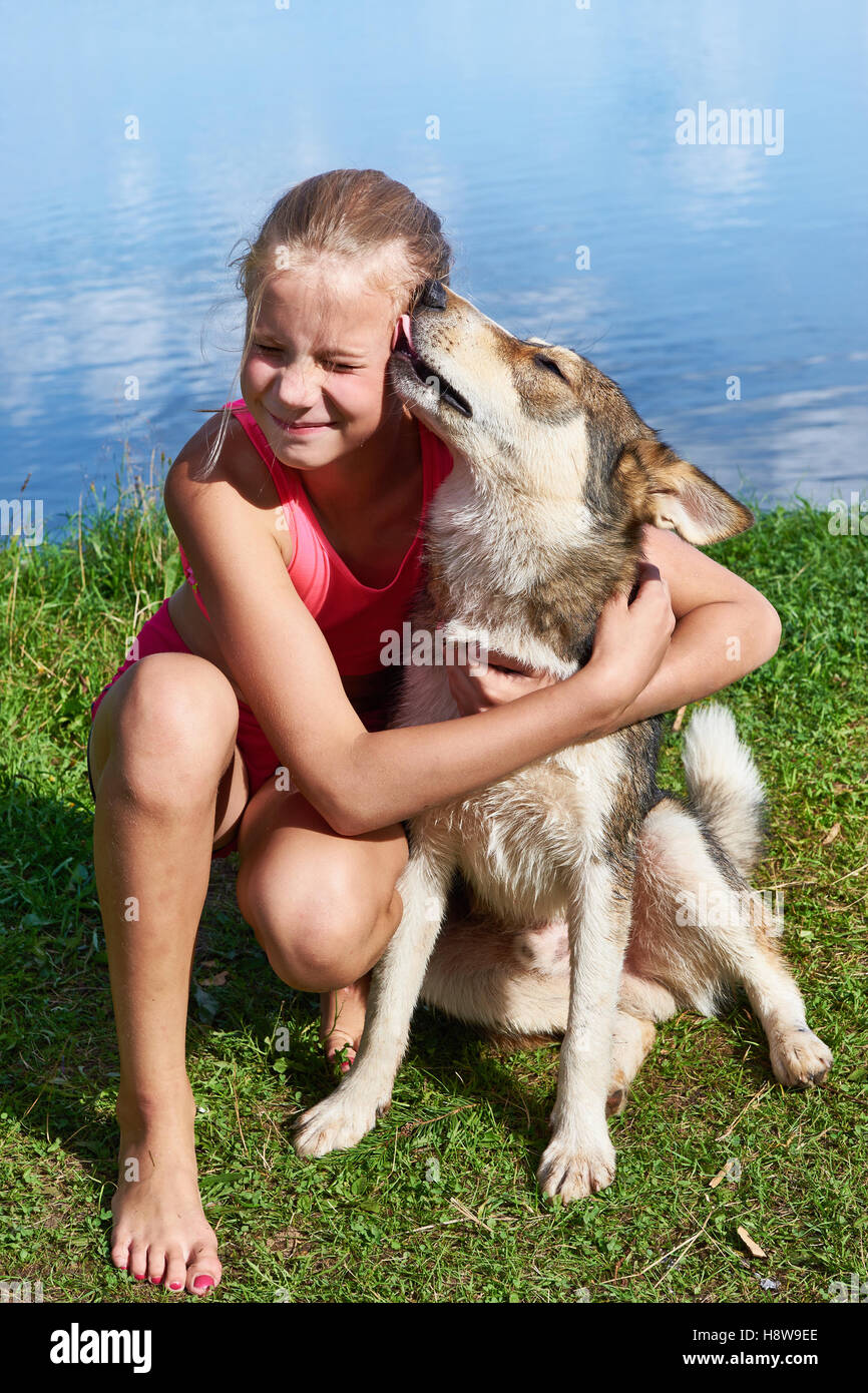Happy girl with her dog Stock Photo - Alamy