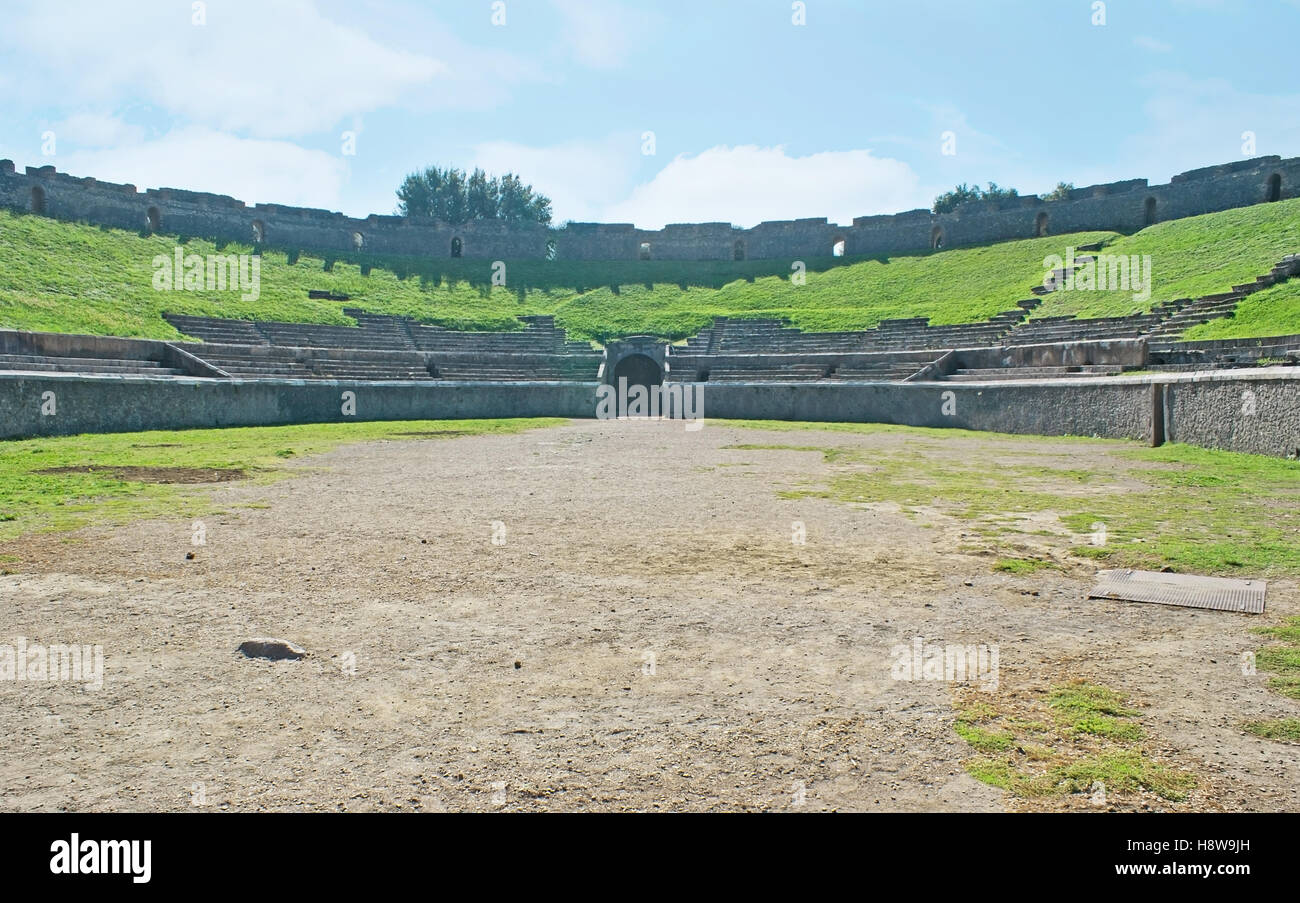 The walk along arena of the ancient Amphitheater of Pompeii, Italy ...