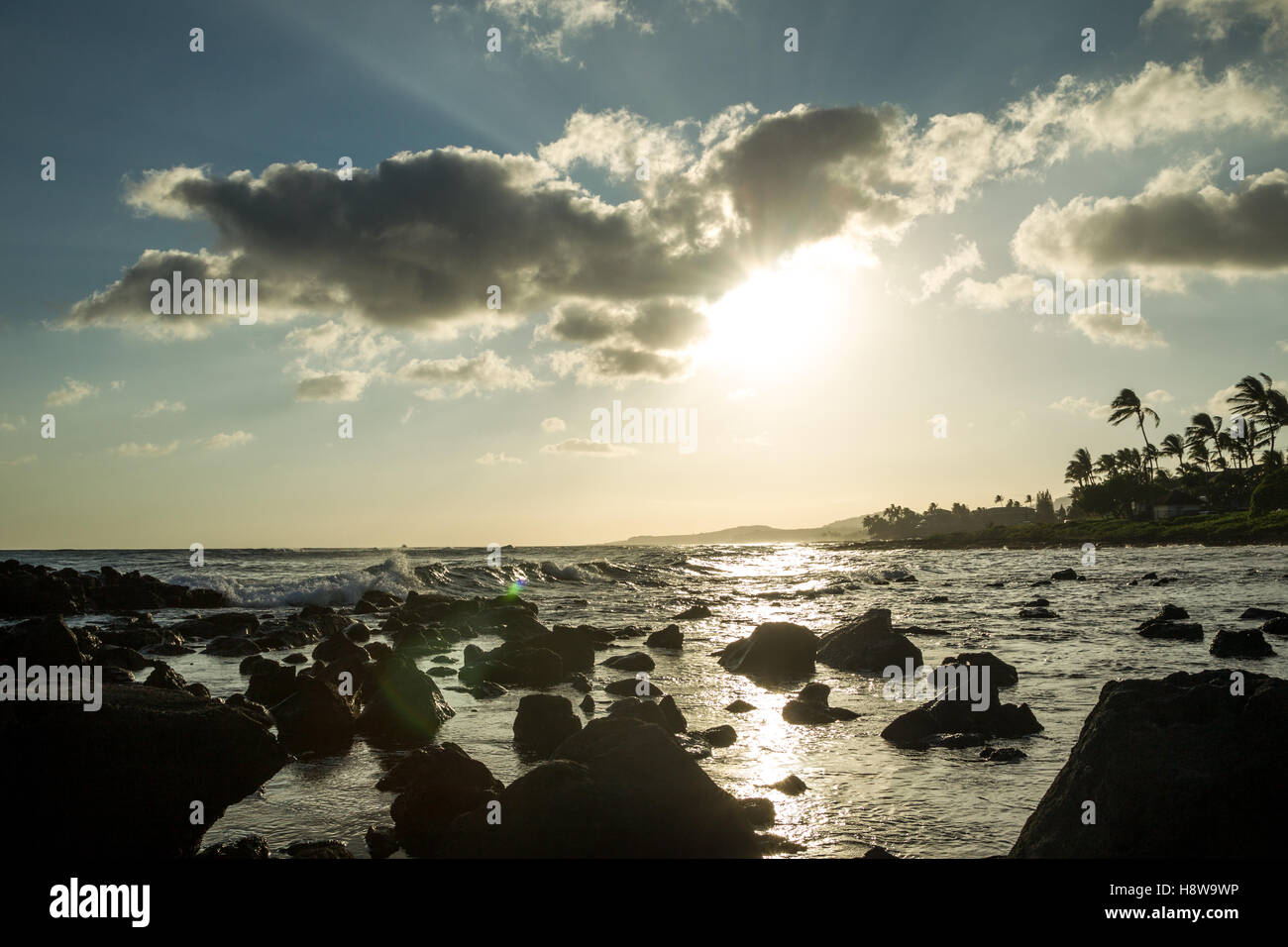 Sun setting over the southern coast of Kauai, Hawaii, USA Stock Photo ...