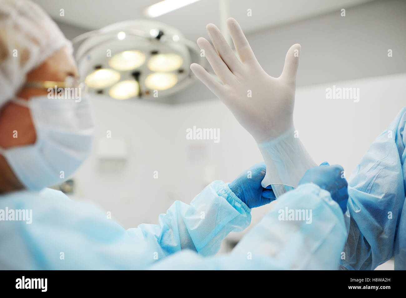 surgeon's hands in gloves closeup. Surgeons team preparing for a ...
