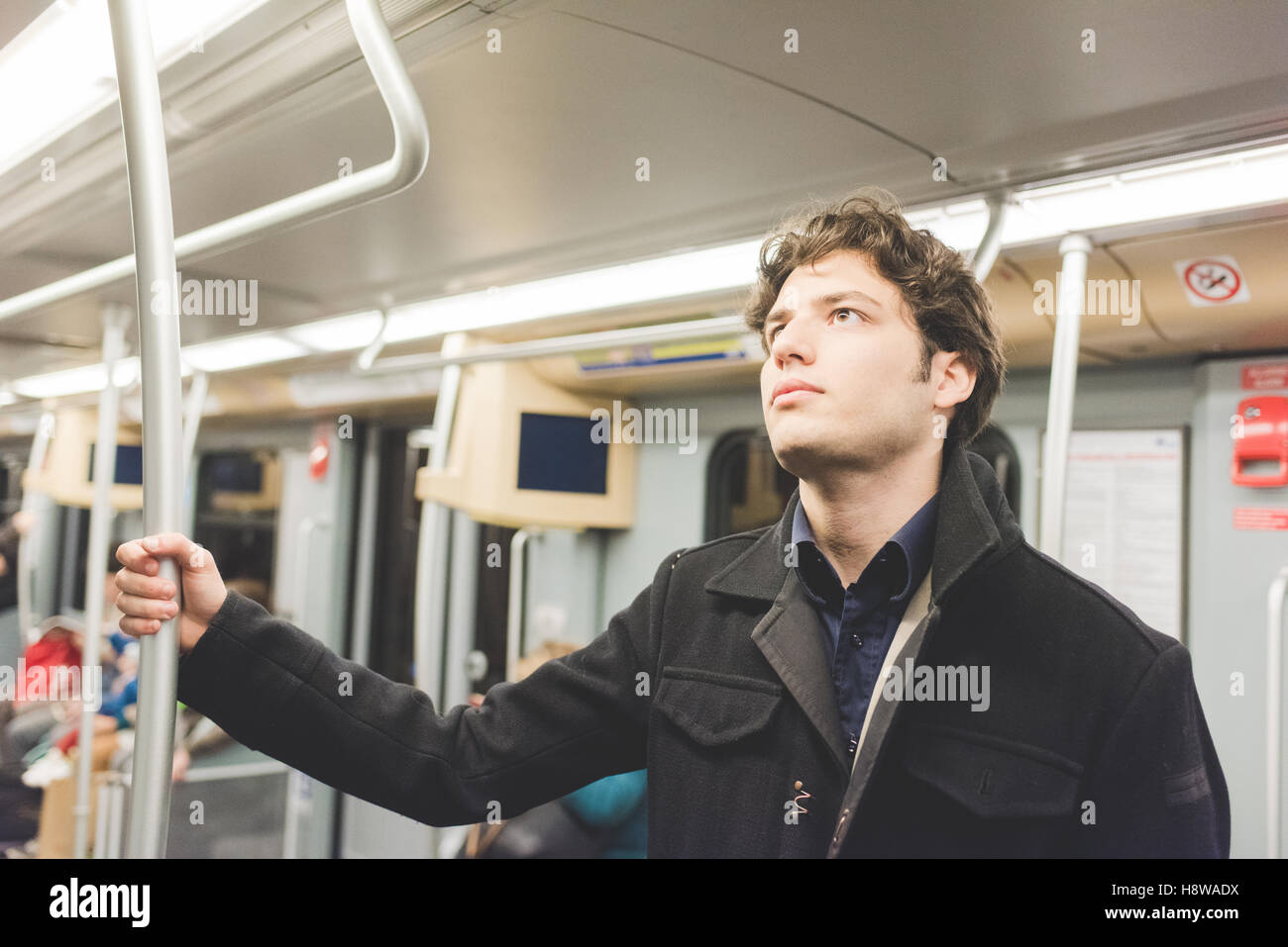 Young beautiful caucasian man commuter in the subway - commuting ...