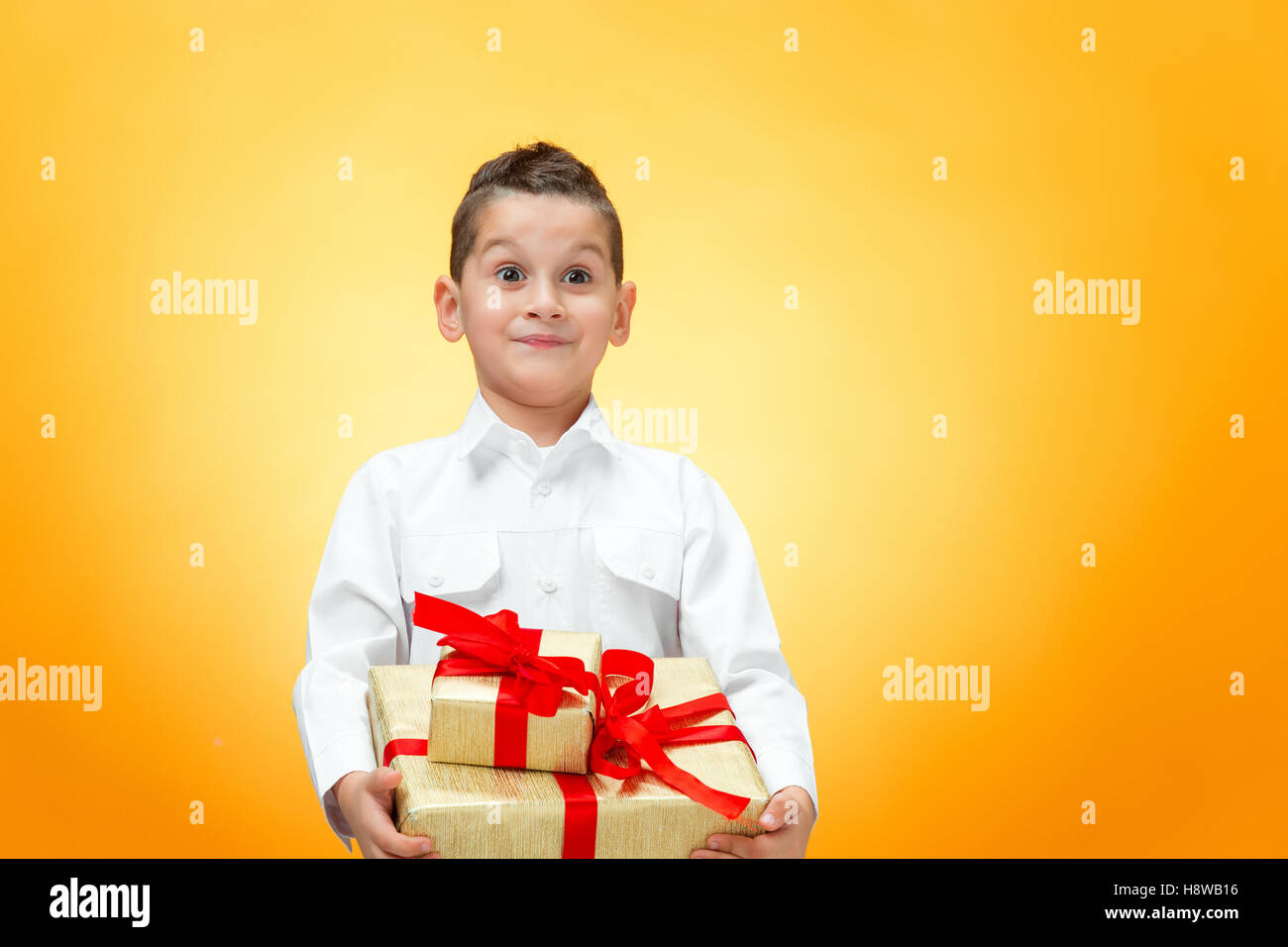 The boy with gift box Stock Photo - Alamy
