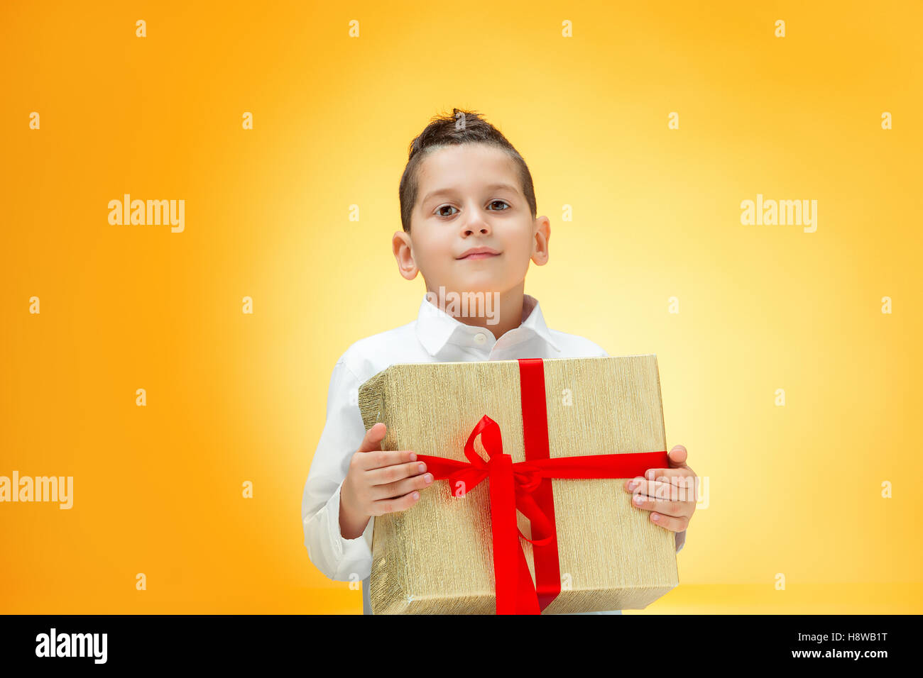 The boy with gift box Stock Photo - Alamy