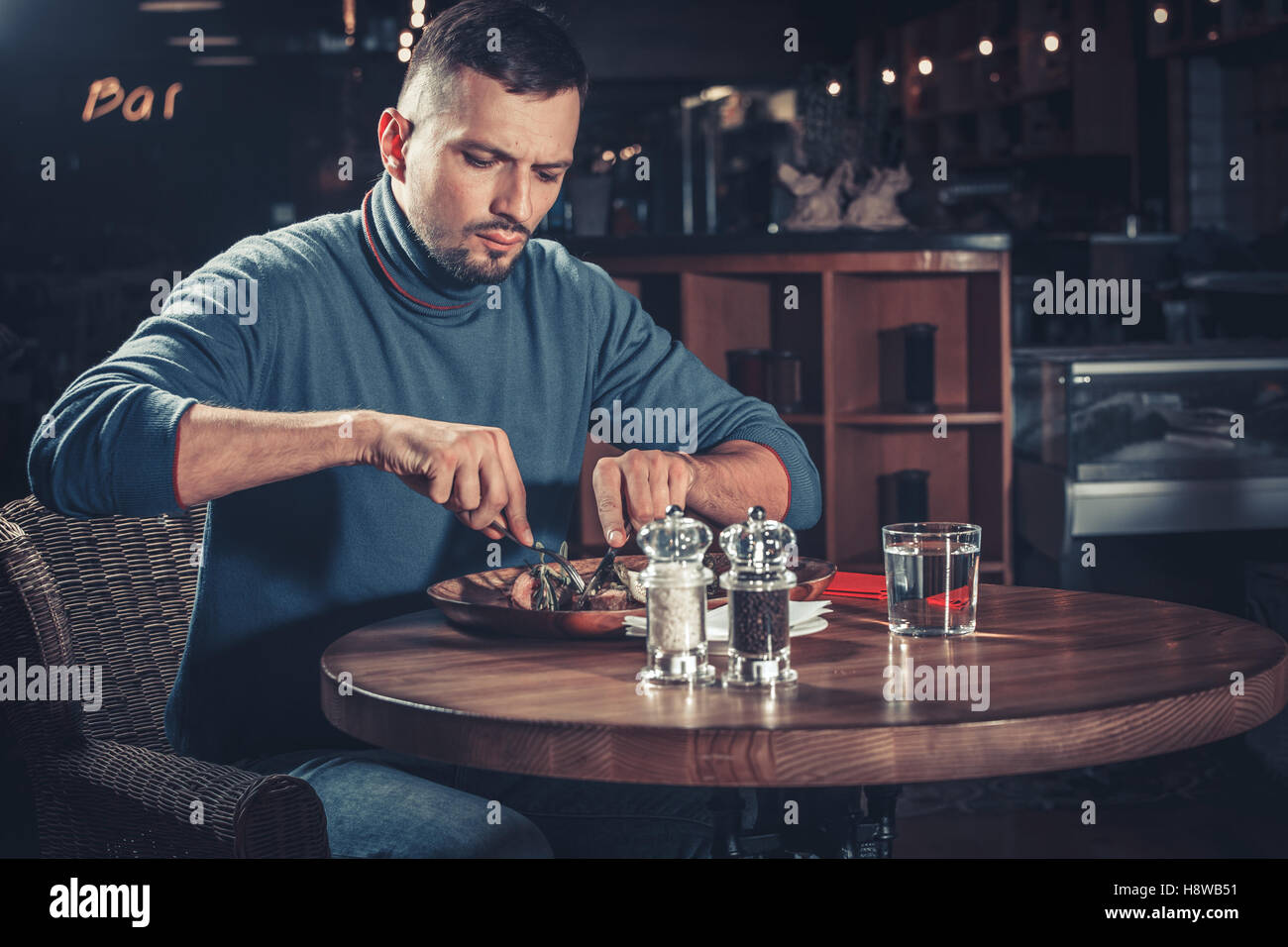 Handsome man at restaurant Stock Photo - Alamy