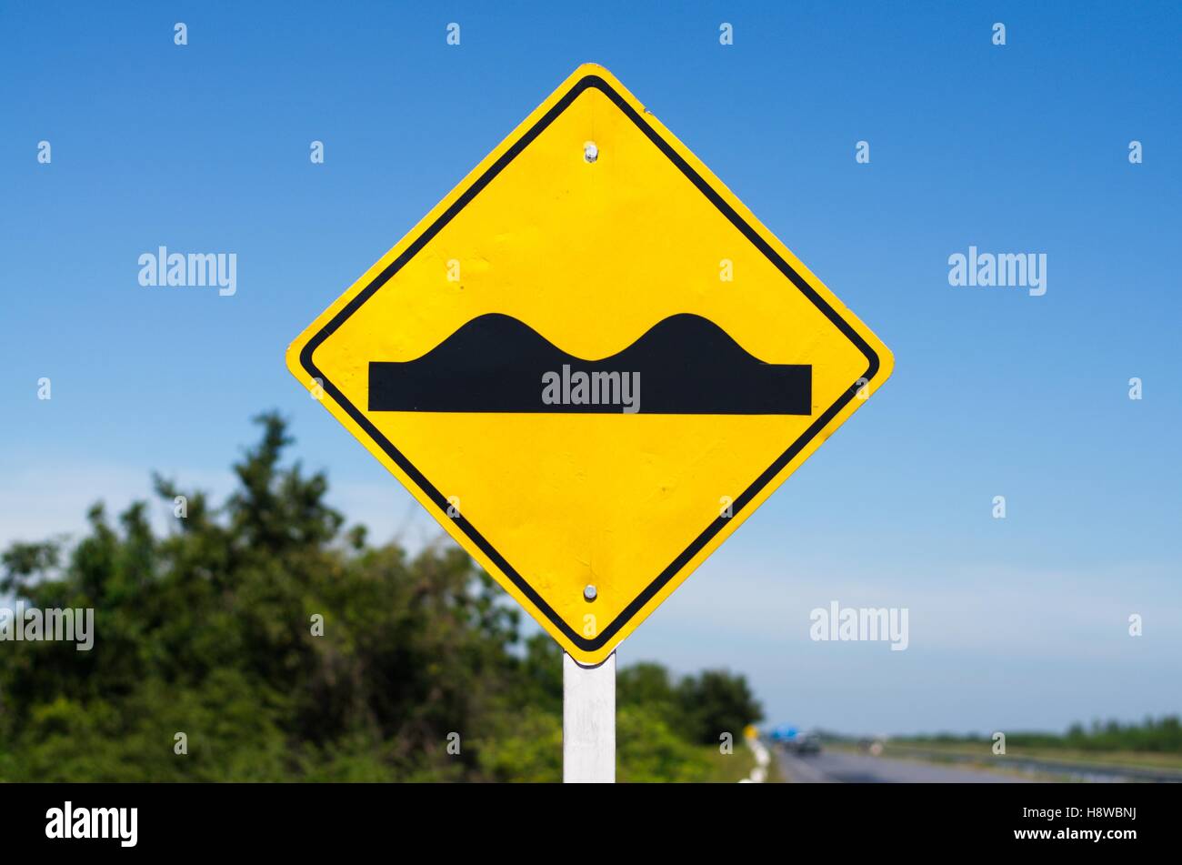 Traffic sign symbols in black on a yellow ground Stock Photo - Alamy