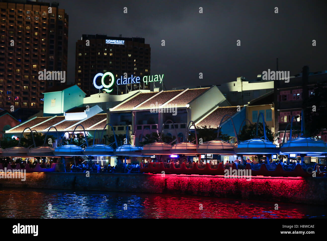 Colorful light building at night in Clarke Quay, Singapore Stock Photo ...