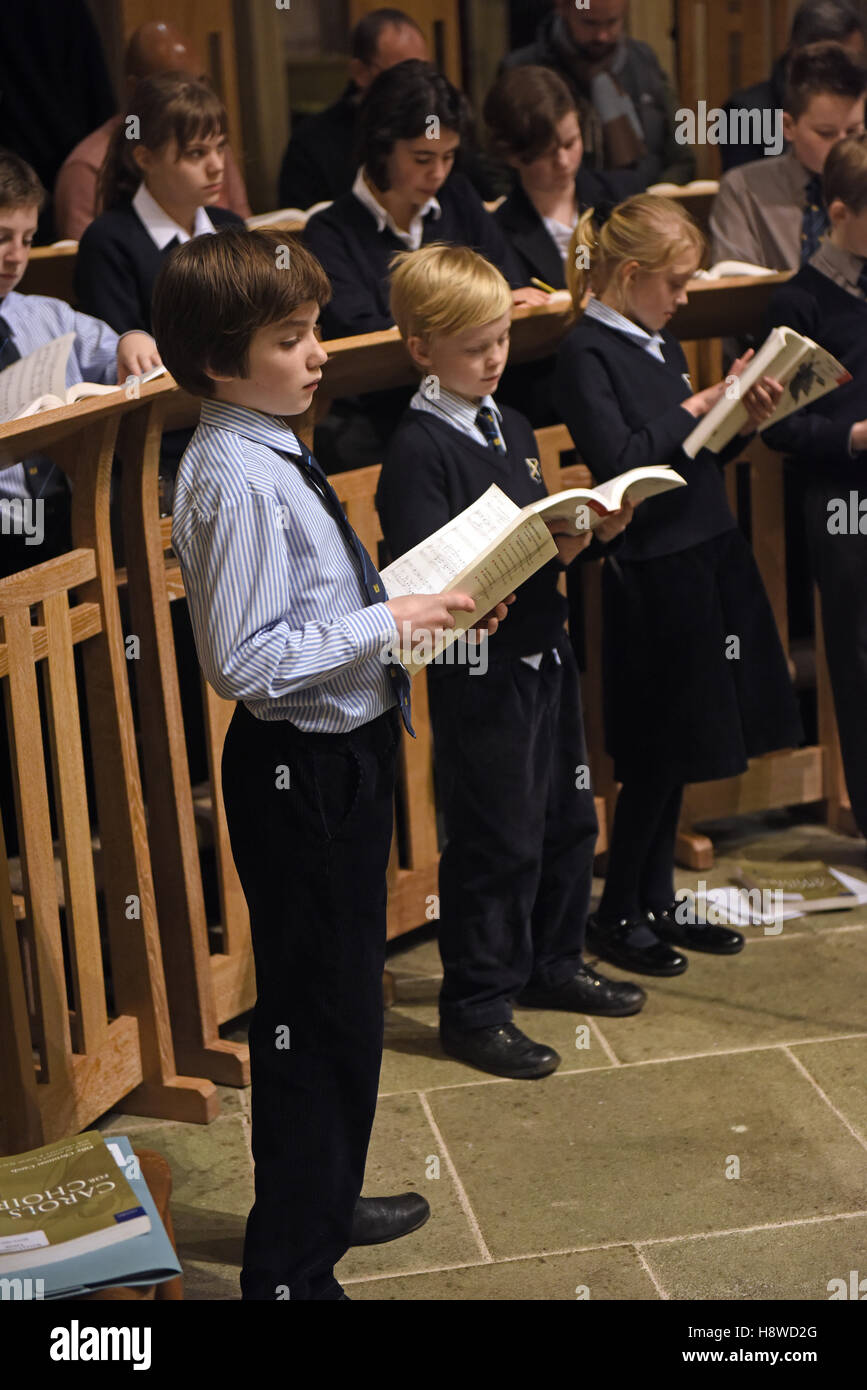 Choristers being conducted by choir master at a recording session for a ...