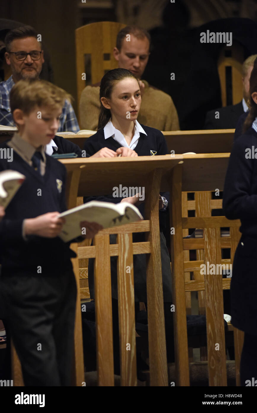 Choristers being conducted by choir master at a recording session for a ...
