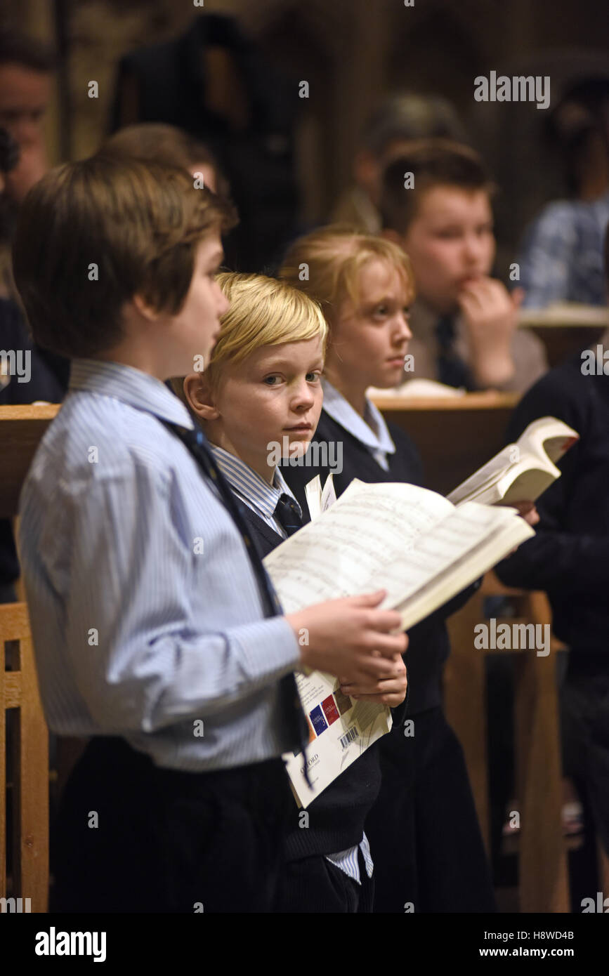 Choristers being conducted by choir master at a recording session for a ...