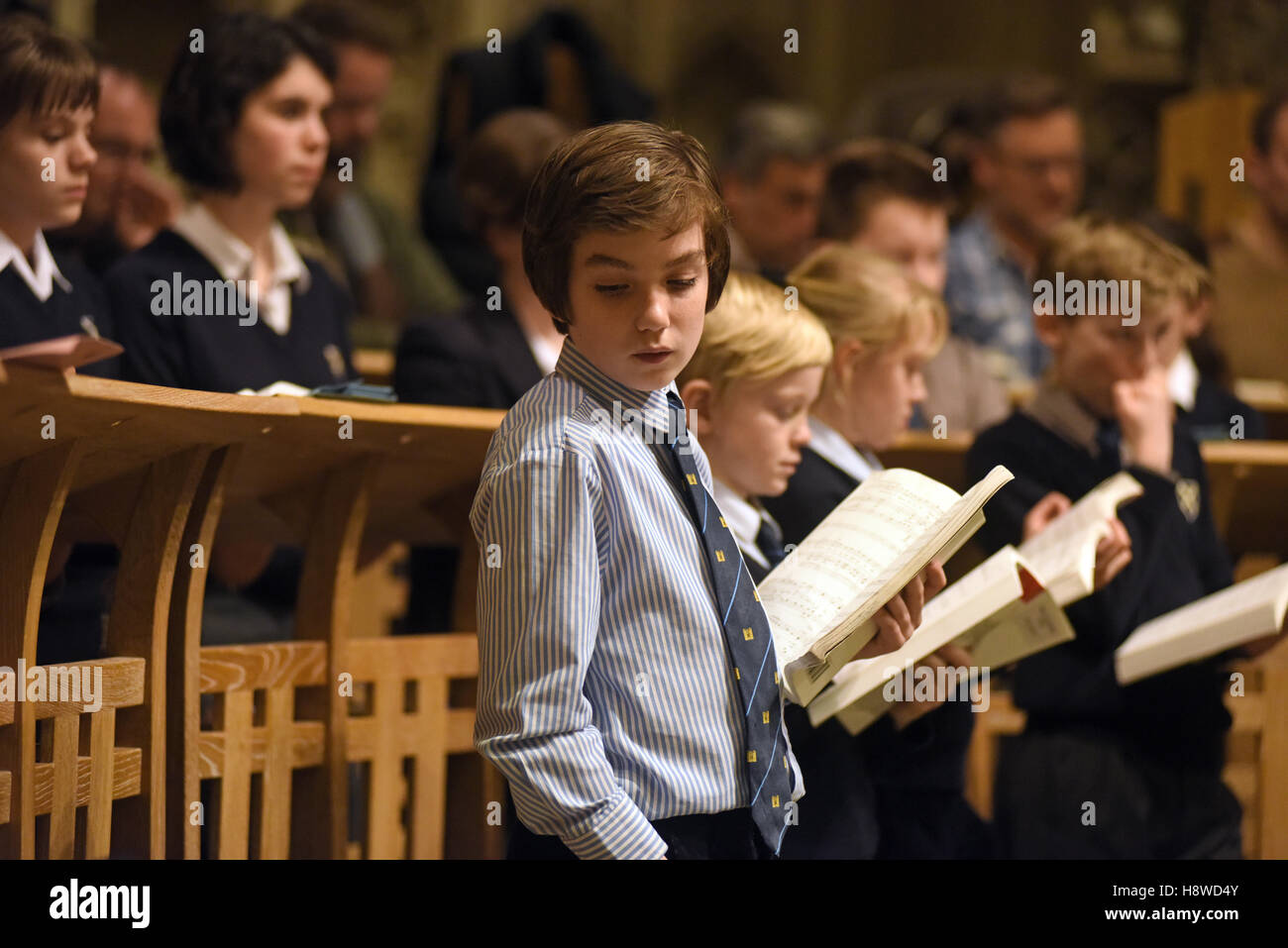 Choristers being conducted by choir master at a recording session for a ...