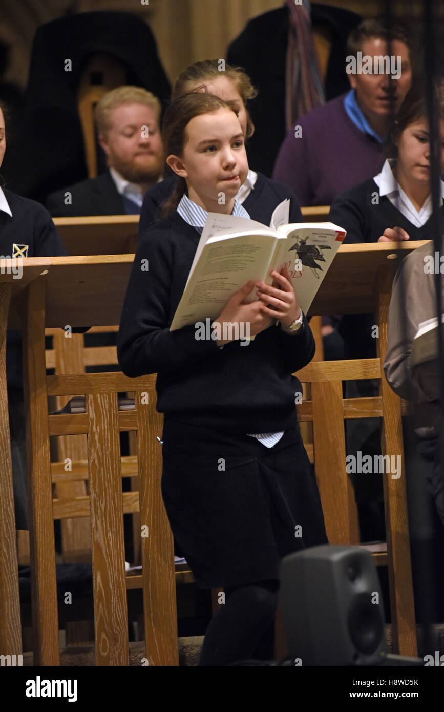 Choristers being conducted by choir master at a recording session for a ...