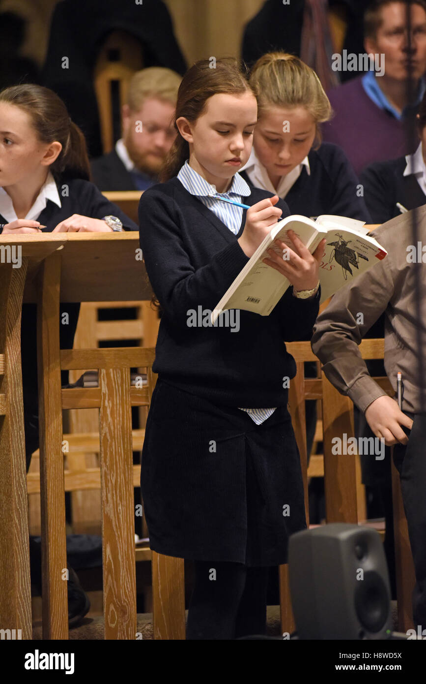 Choristers being conducted by choir master at a recording session for a ...